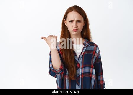 Clueless upset redhead young cute female coworker shrugging hands ...