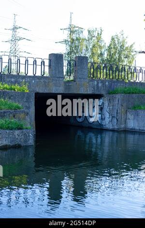 A pedestrian cross a bridge over the Bow River in Banff, Alta., Tuesday ...