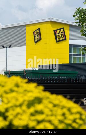 exterior of a big yellow self storage unit Stock Photo - Alamy