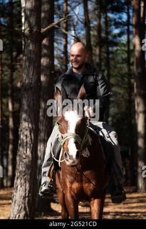 Young Man Rider With Her Horse Enjoying Good Mood in Evening Sunset ...