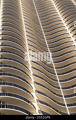 Modern multistory building with wavy exterior. Wave like building view ...