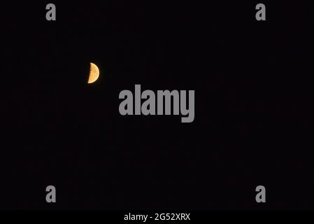 One half moon in the dark sky.Night Evening Sky Blue Moon.Copy space ...