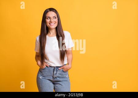 Photo of cheerful adorable lady hold fur arm show blank empty space ...