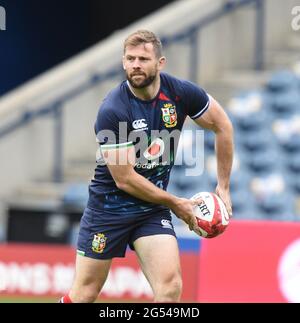 Elliot Daly of the British & Irish Lions is held by Western Forces' Ben ...