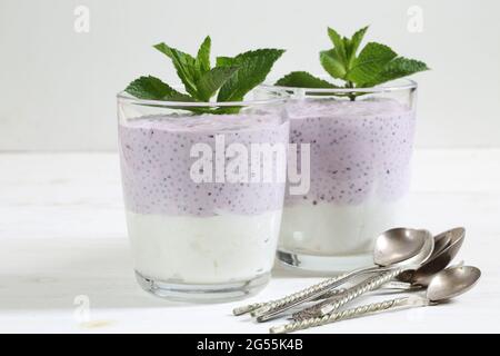 Curd dessert with chia and mulberry on white plate Stock Photo - Alamy