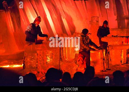 Playing musical instruments carved from solid ice in Norway ...