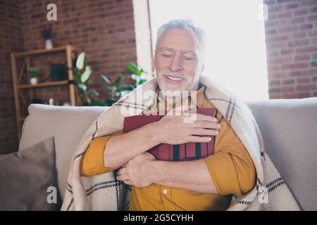 Photo of satisfied dreamy person hands hug shoulder look camera ...