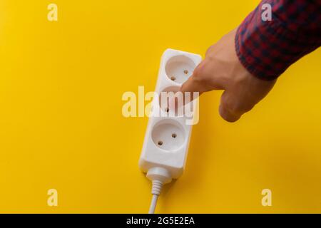 caution, hand insert the finger into the electricity socket, danger and ...