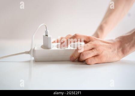 caution, hand insert the finger into the electricity socket, danger and ...