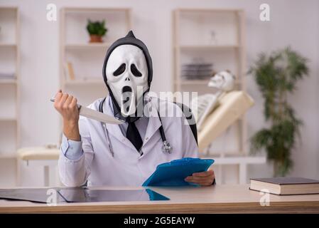 Devil doctor working at the hospital Stock Photo - Alamy