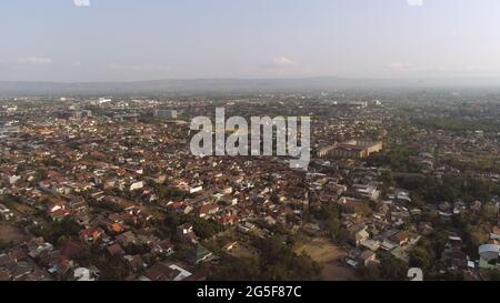 cityscape Yogyakarta with buildings, highway at sunset time. aerial ...