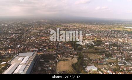cityscape Yogyakarta with buildings, highway at sunset time. aerial ...