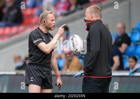 Referee Robert Hicks speaks directly to a Salford Red Devils ballboy ...