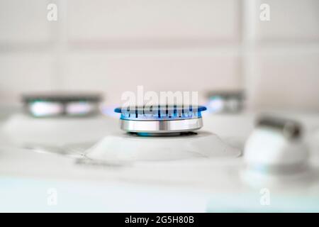 close up macro shot of birning gas ring on light background, natural ...