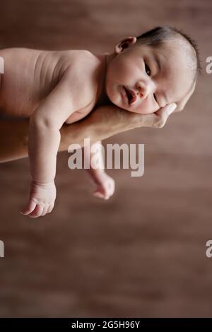 cute newborn baby carried by her mother's hand Stock Photo - Alamy