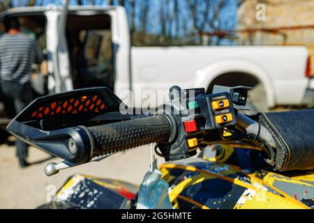Handlebar of four-wheeled ATV quad bike close up Stock Photo - Alamy