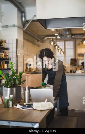 Male employee working in box delivery relocation service Stock Photo ...