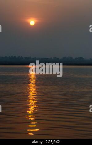 Sun through mist in Varanasi India Stock Photo - Alamy