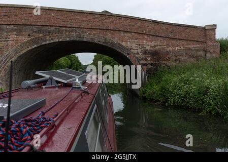 Barge going under road bridge Kennet and avon canal Stock Photo - Alamy