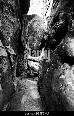 Stuck sandstone boulder above narrow pass Stock Photo - Alamy