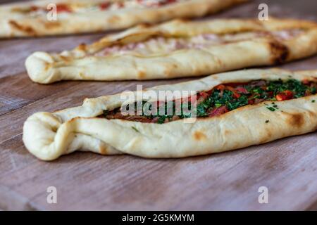 Closeup shot of delicious flatbread pockets with different fillings ...