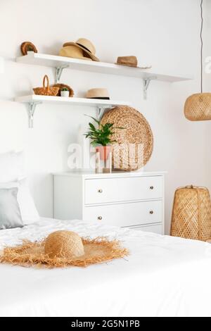 Interior of stylish bedroom with hats Stock Photo - Alamy