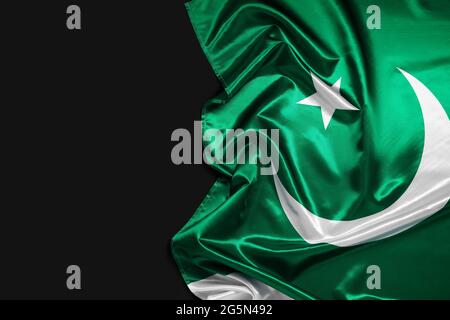Pakistan flag on dark background Stock Photo - Alamy