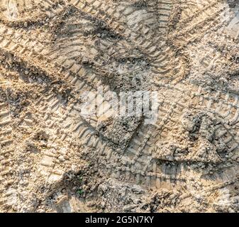 An aerial view of tractor tire marks in the fertile farm fields of ...