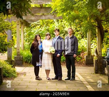 Multiracial couple and young son smiling and hugging outdoors Stock ...