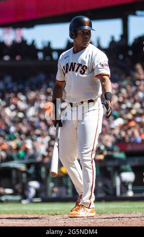 San Francisco Giants' LaMonte Wade Jr. smiles in the dugout prior to a ...