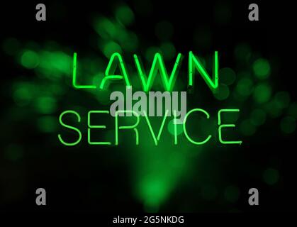 Vintage Neon Lawn Service Sign Stock Photo - Alamy