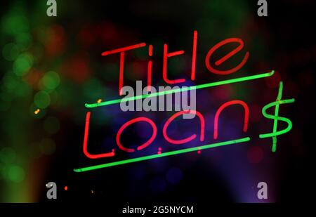 Vintage Neon Title Loan Sign Stock Photo - Alamy