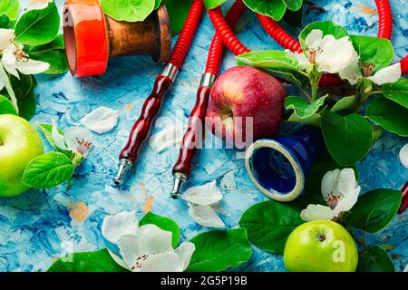 Oriental hookah with the aroma of fresh apples. Floral shisha tobacco ...