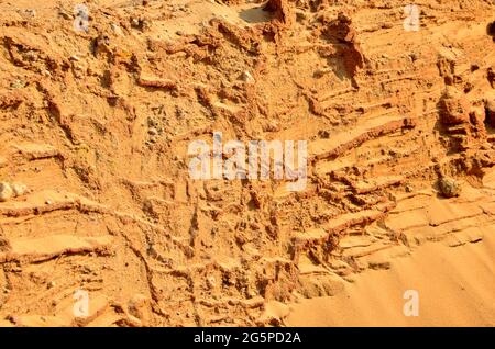 Texture of different sand pile layers of clay underground in a mining ...