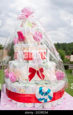 Festive wrapped gifts including a red Merry Christmas box stacked on ...