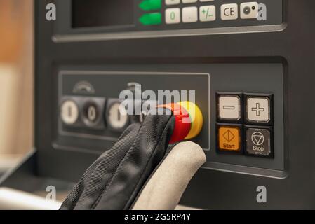 The emergency stop button on a CNC wire erosion machine, precision ...