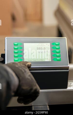 The process of programming a CNC machine. Entering data into a computer controlled machine. CNC ...