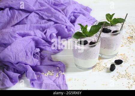 Curd dessert with chia and mulberry on white plate Stock Photo - Alamy