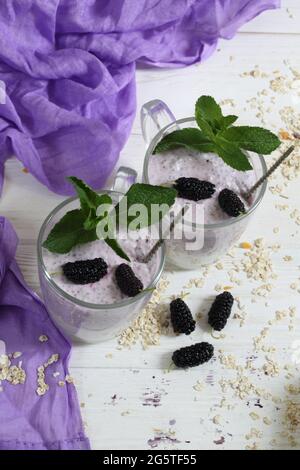 Curd dessert with chia and mulberry on white plate Stock Photo - Alamy