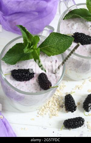Curd dessert with chia and mulberry on white plate Stock Photo - Alamy
