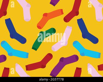 Multi-colored socks on a yellow background. View from above. Many ...