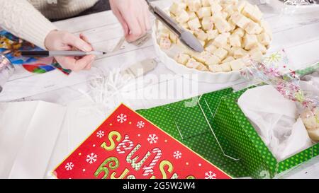 Step by step. Packaging homemade fudge and cookies into a Christmas ...