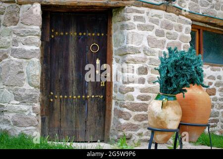A woman in front of an authentic Anatolian house door Stock Photo - Alamy