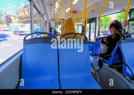 tables with chairs across colorful buildings in a restaurant terrace ...