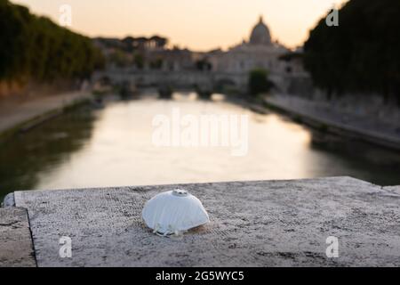Respiratory protection mask lies on the concrete. Medical mask on the ...