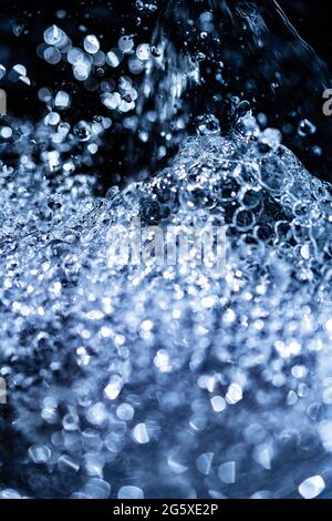 Water bubbles close-up. Tap water from a faucet. Extreme macro close-up ...
