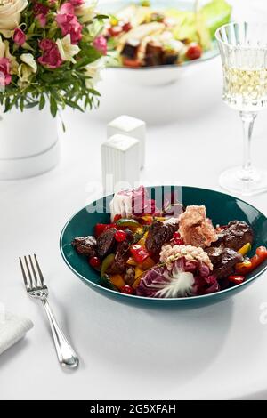Slices of fried liver, green leaves of salads. Studio Photo Stock Photo ...