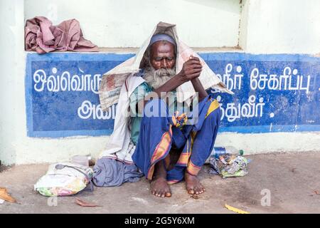 Indian man begging on streets in Bombay Stock Photo - Alamy