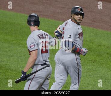 Minnesota Twins' Nelson Cruz (23) points to the sky after hitting a two ...