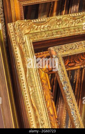 Old Gold Picture Frames on wooden wall Stock Photo - Alamy